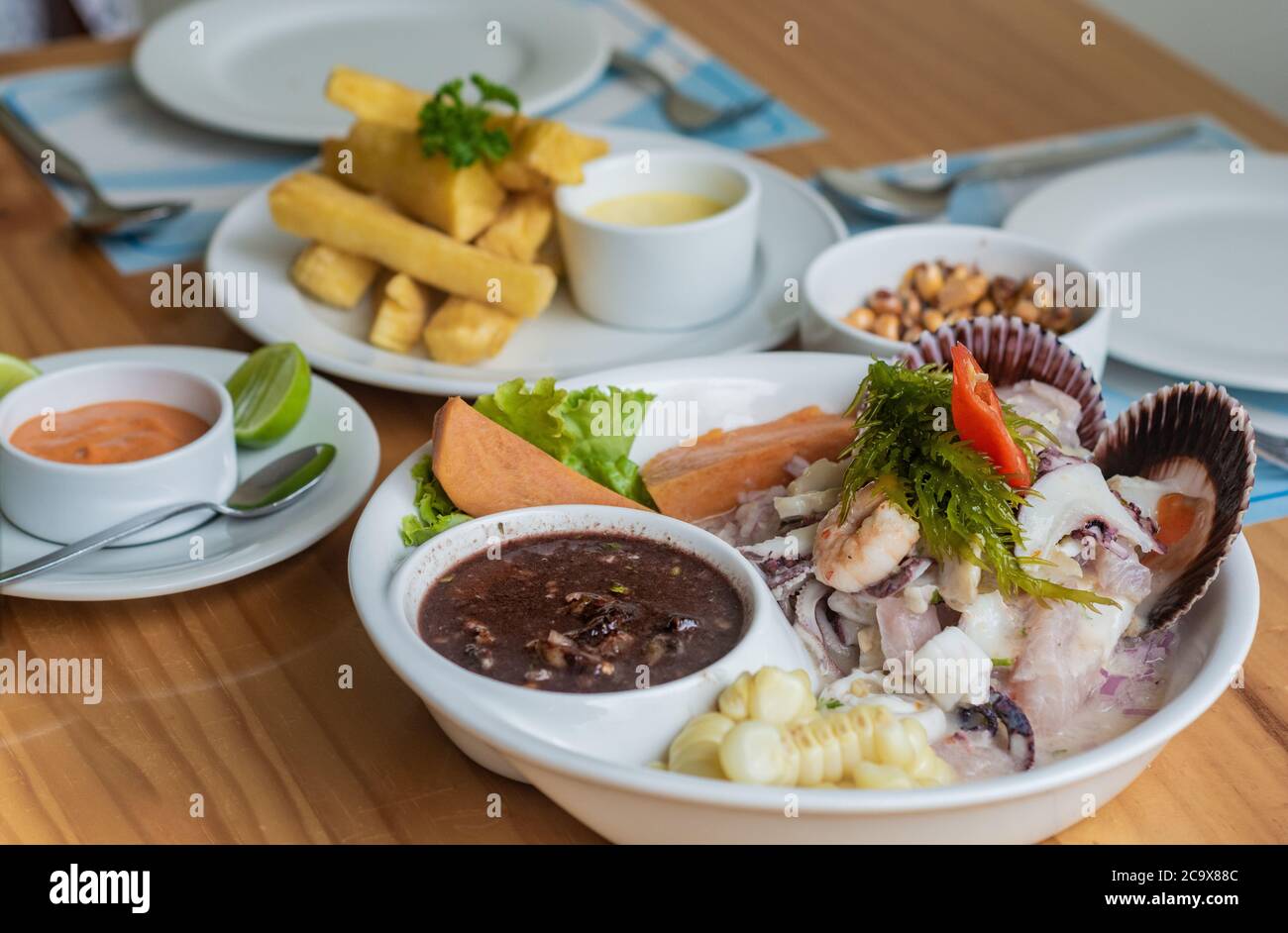 Typical Peruvian shrimp ceviche served with cassava, corn and spicy ...