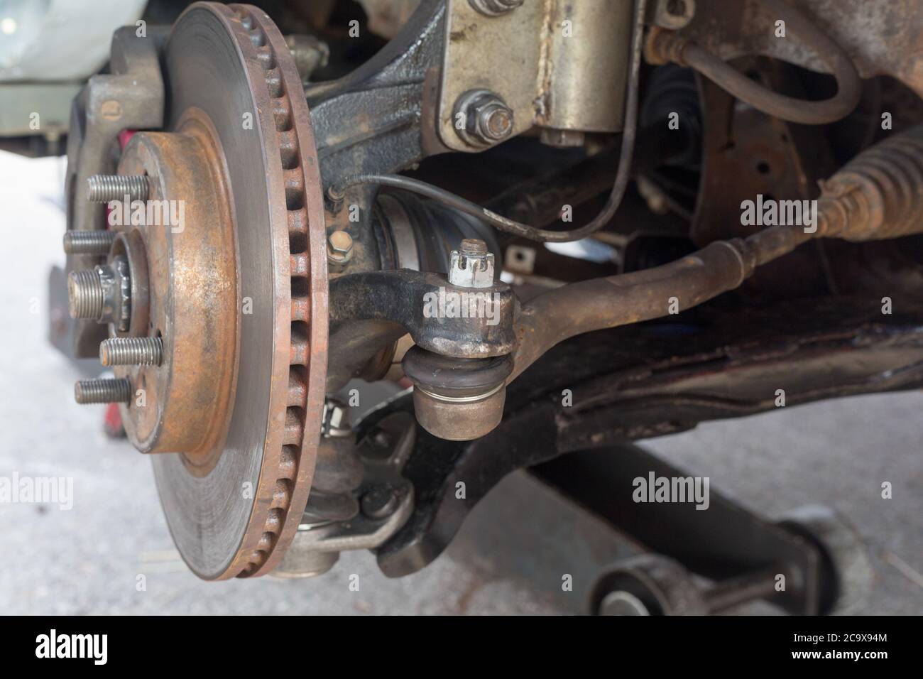 Front disk brake and ball joint tie rod end of rally racing car Stock ...