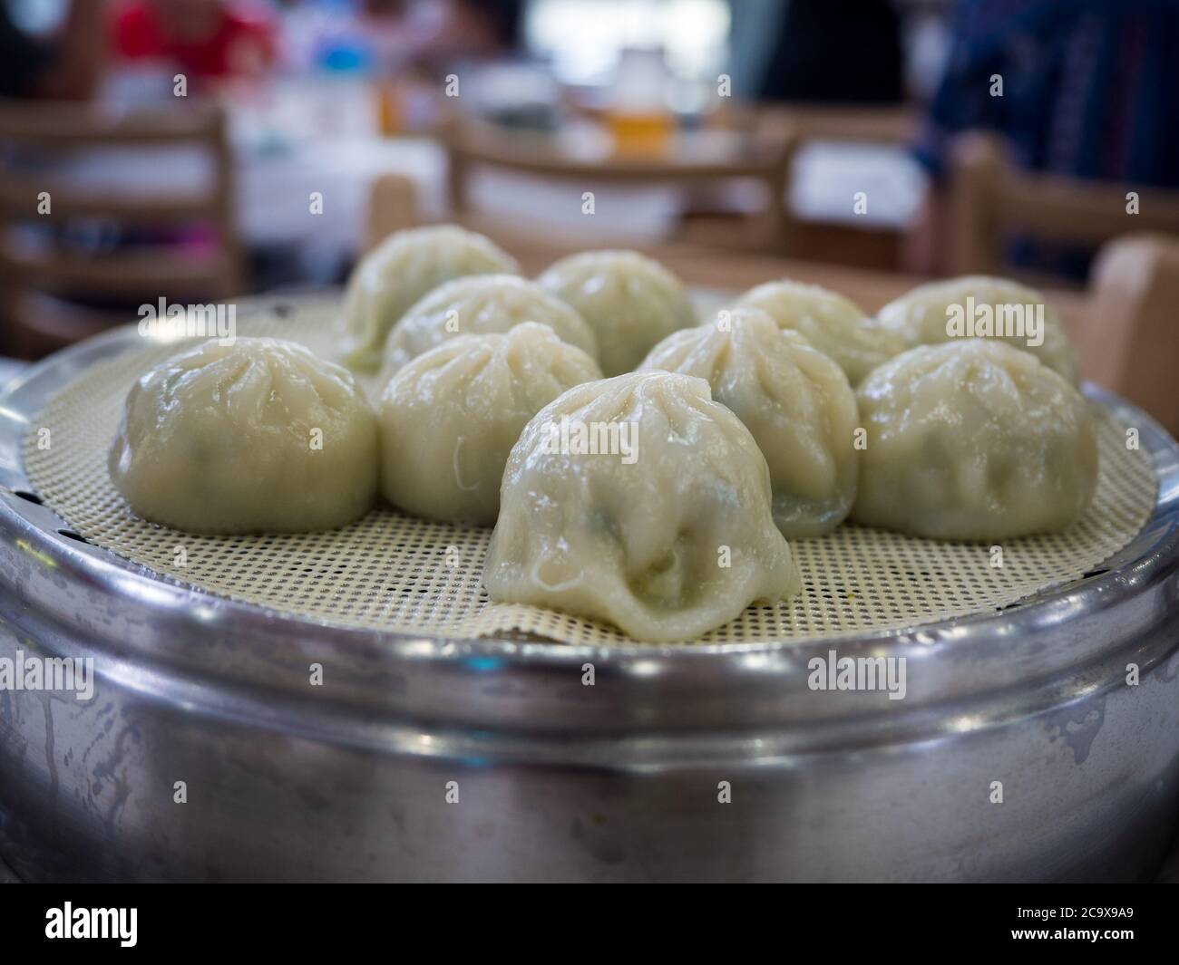 Jjin mandu, or Korean style steamed dumpling filled with a mixture of ...