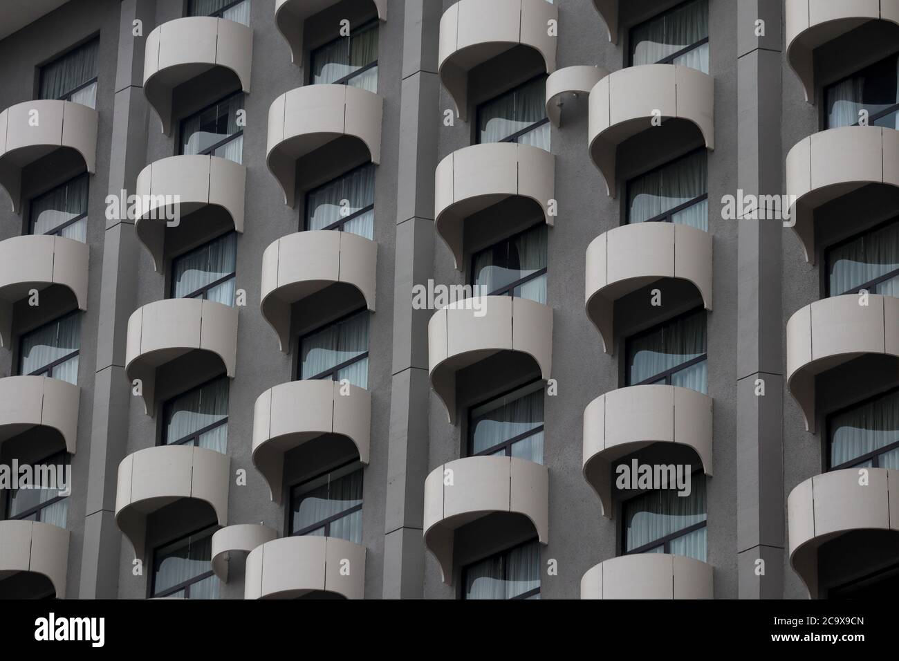 building exterior with round window texture Stock Photo - Alamy