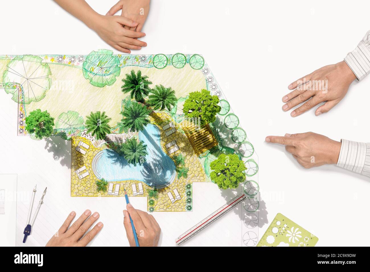 Landscape architect changing drawing at meeting with client Stock Photo ...