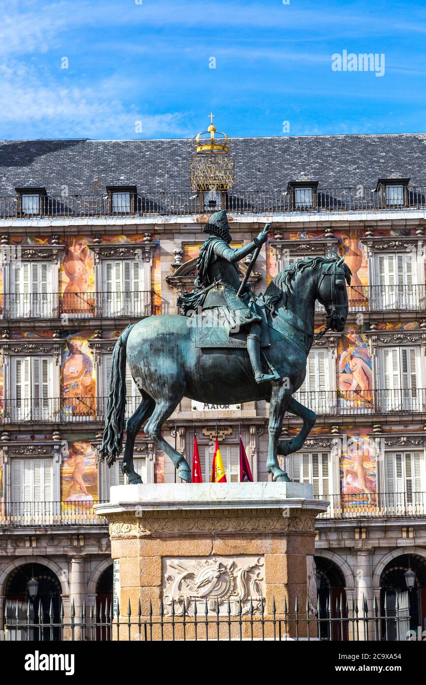 Statue of Philip III at Mayor plaza in Madrid in a beautiful summer day ...