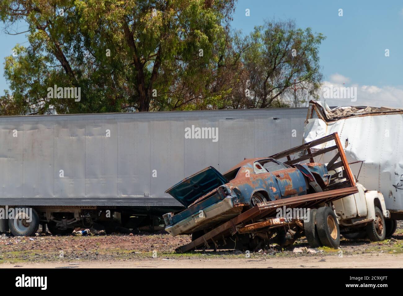 Old damaged cars on the junkyard waiting for recycling in Mexico City ...