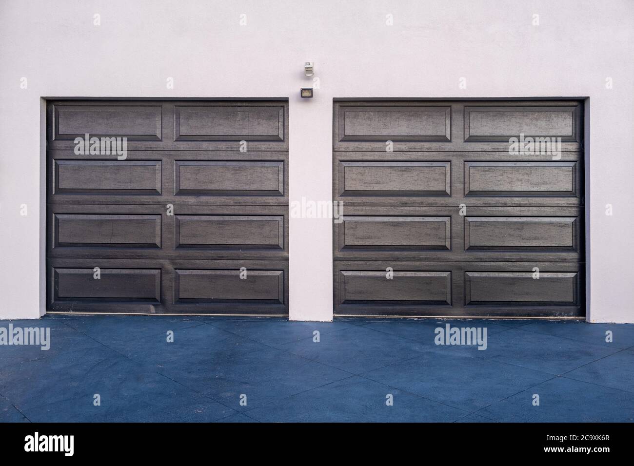 Modern townhouse garage doors - front view Stock Photo - Alamy