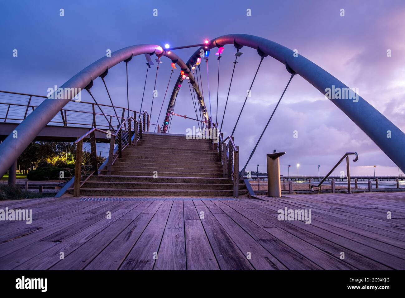 Frankston footbridge at dusk with colorful lights in Melbourne ...