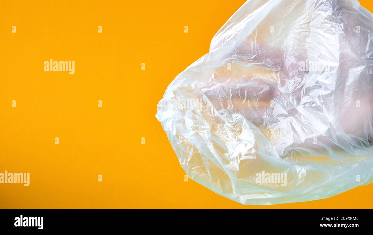 Women dead hand in plastic bag. Murder concept. yellow color background ...