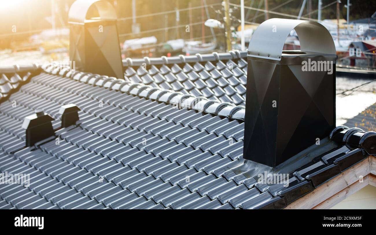 Black roof tiles hi-res stock photography and images - Alamy