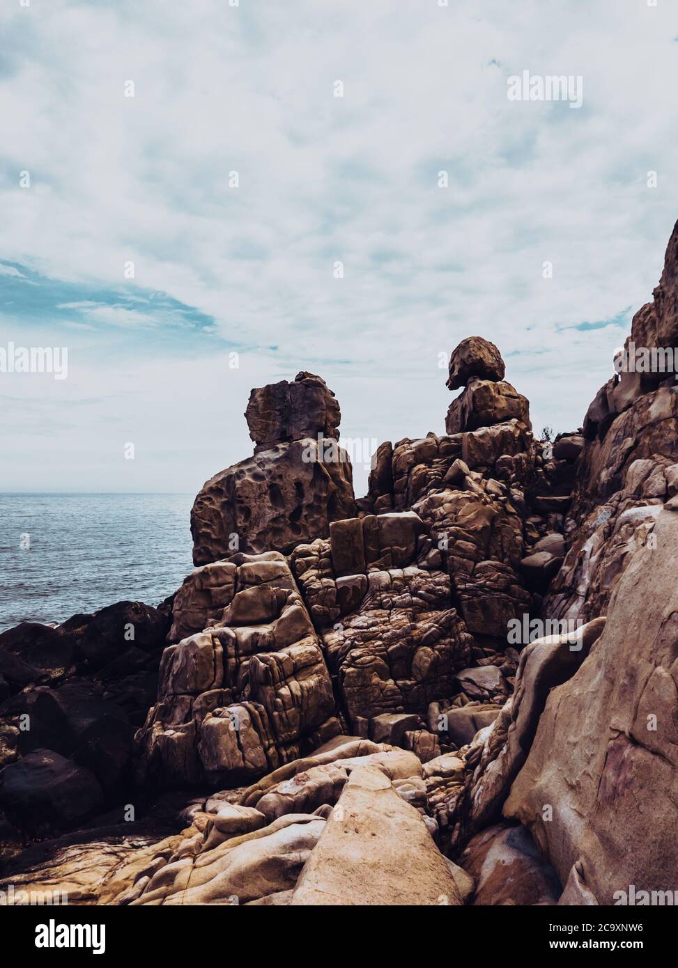 Huge yellow strange stone and sea. Alien planet landscape, rock ...