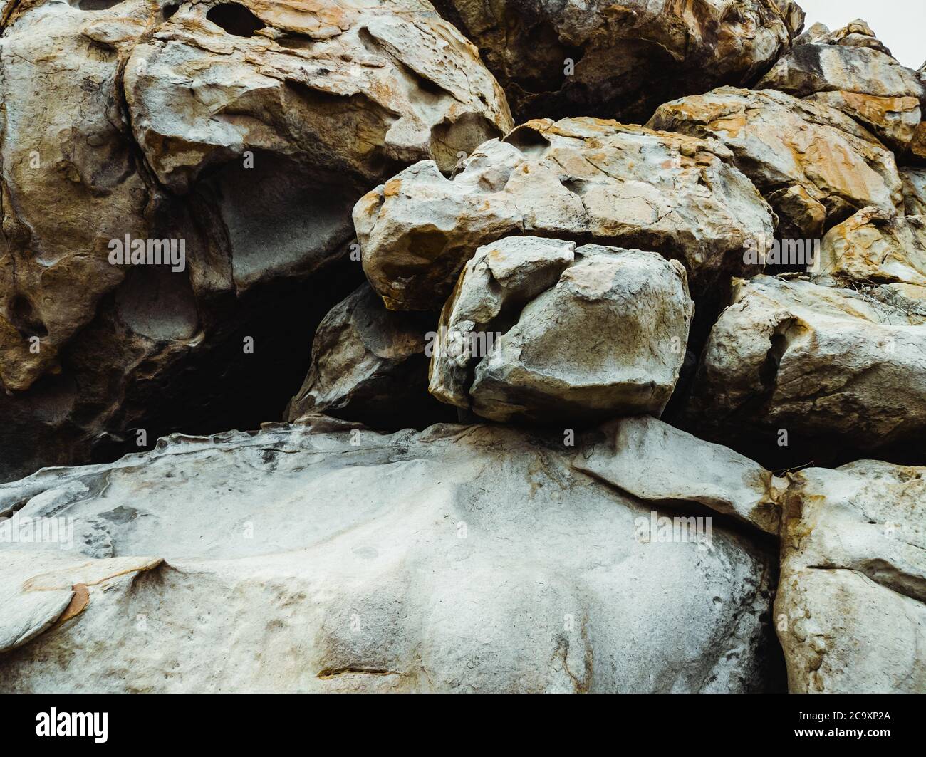 Huge yellow strange stone near sea. Alien planet landscape, rock ...