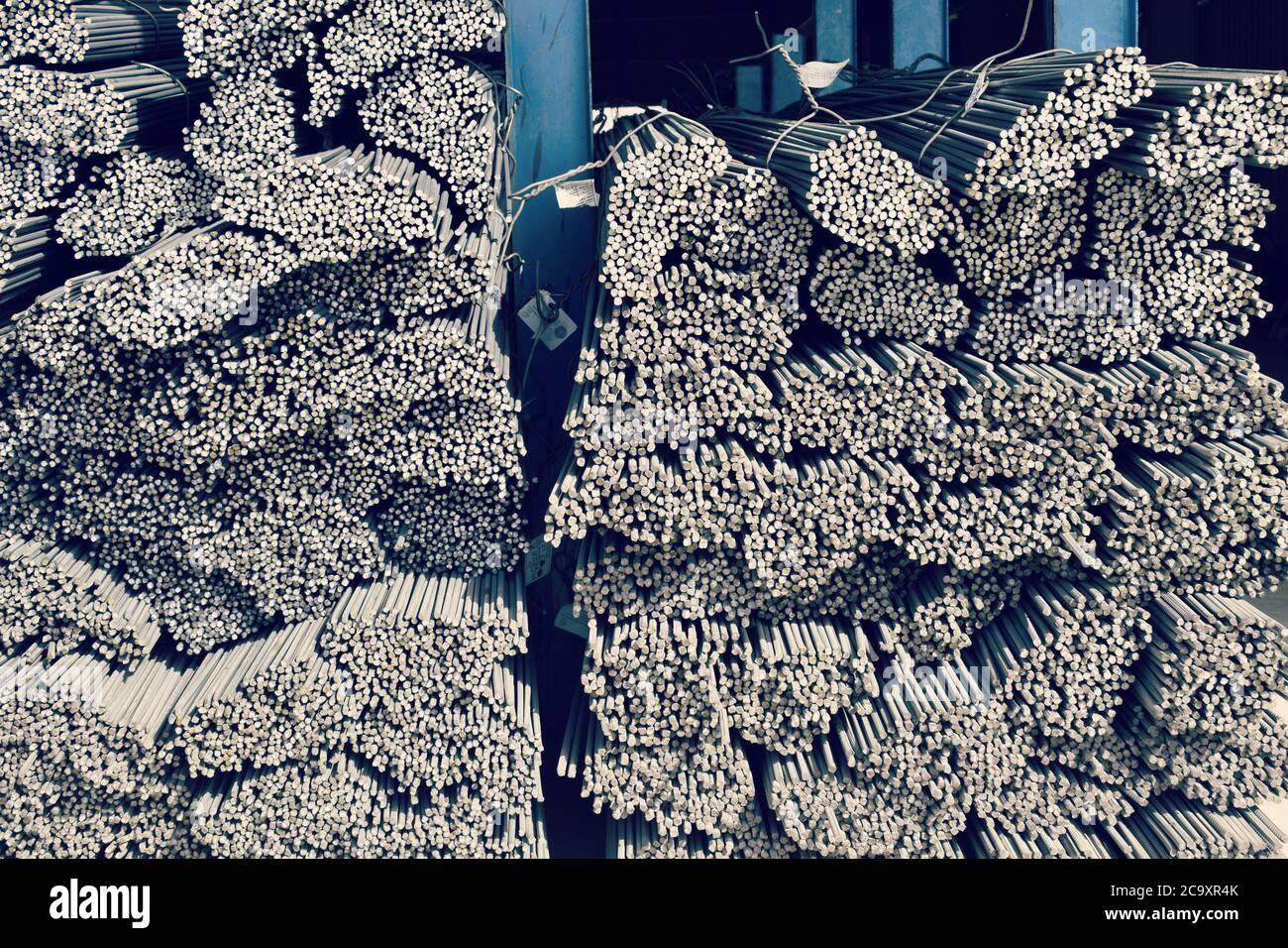 Row of steel rods in the manufacturing industry Stock Photo - Alamy