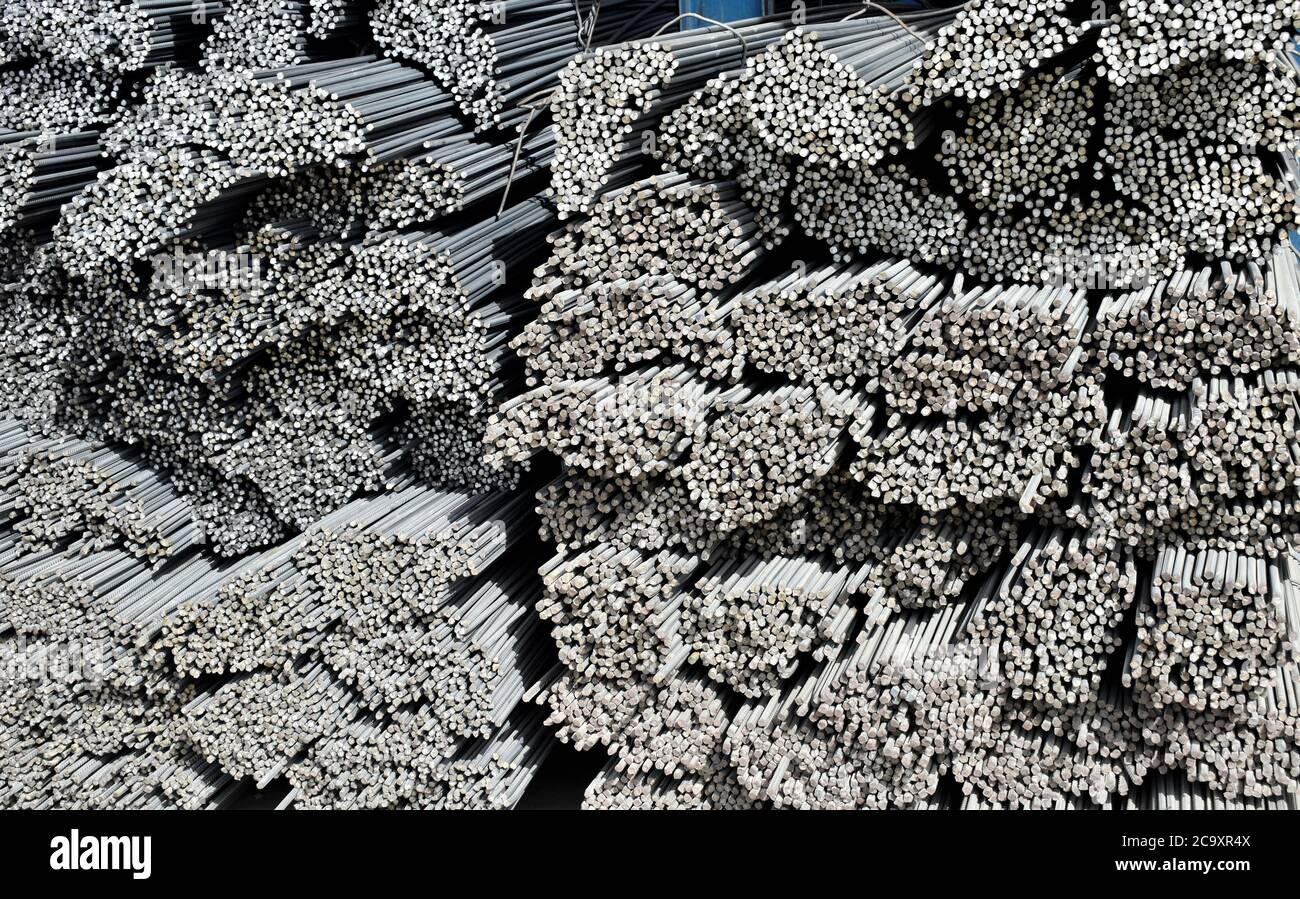 Row of steel rods in the manufacturing industry Stock Photo - Alamy
