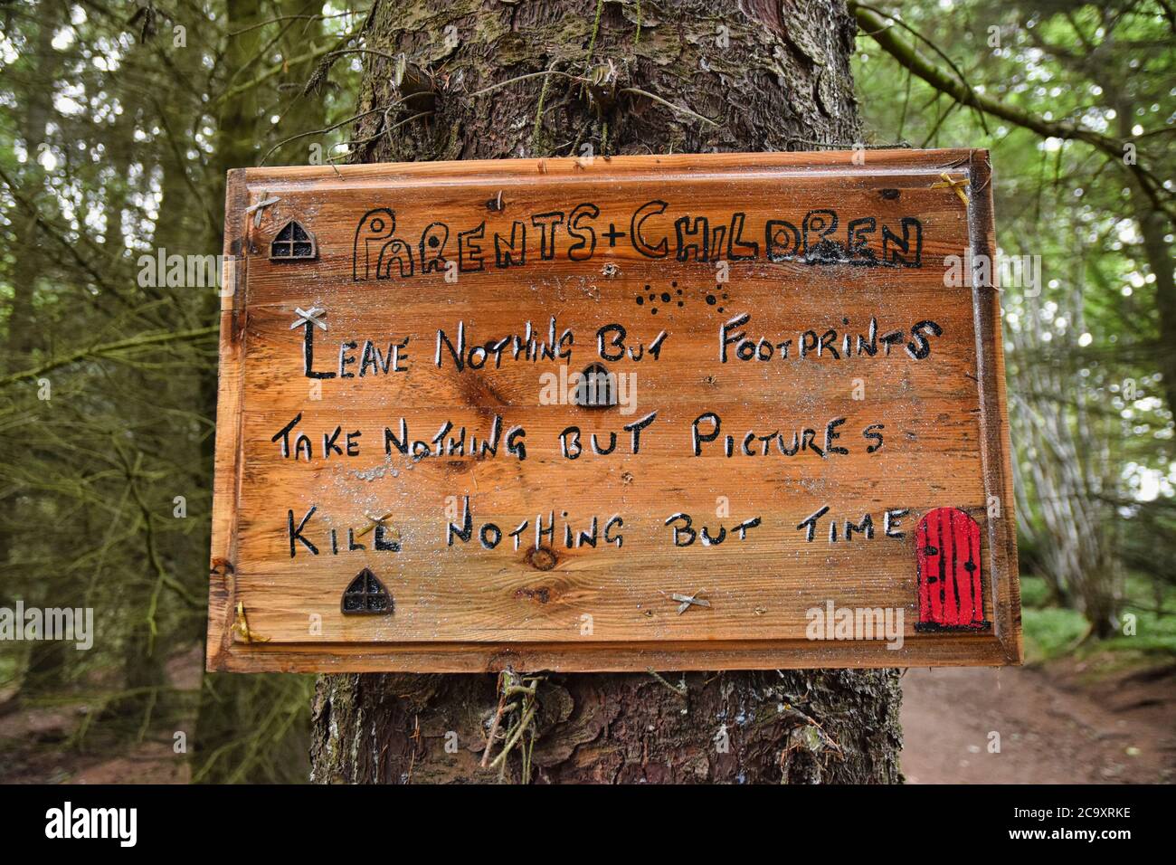 Hand made wooden sign with environmental conservation message, taken on ...