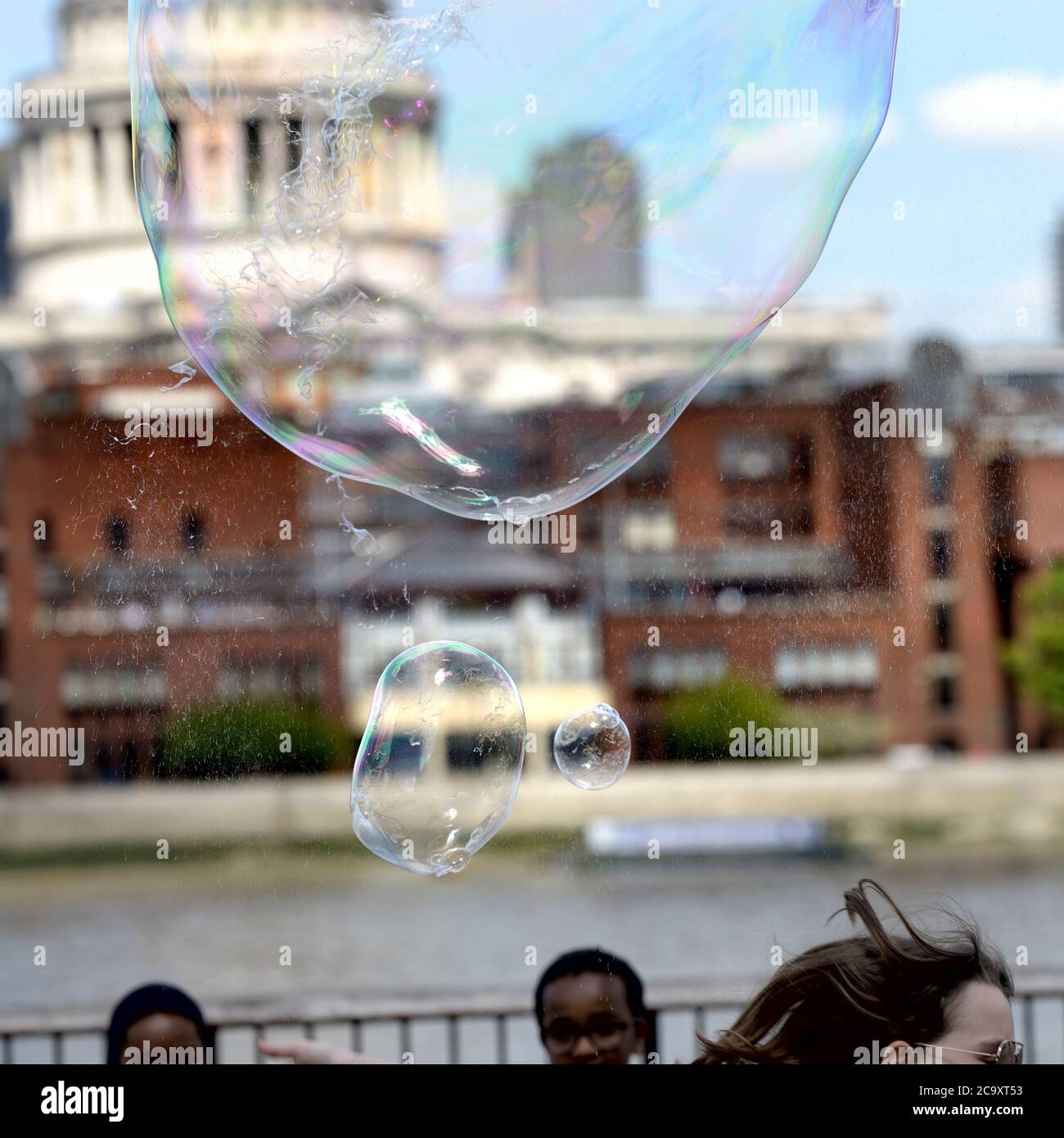 London, England, UK. Large bubble blown by a street entertainer on the ...