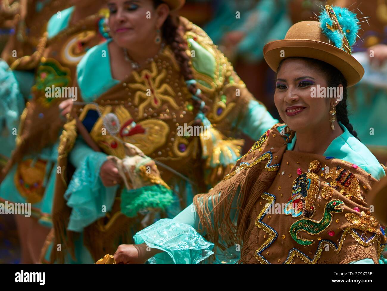 Morenada dancers in ornate costumes parade through the mining city of ...