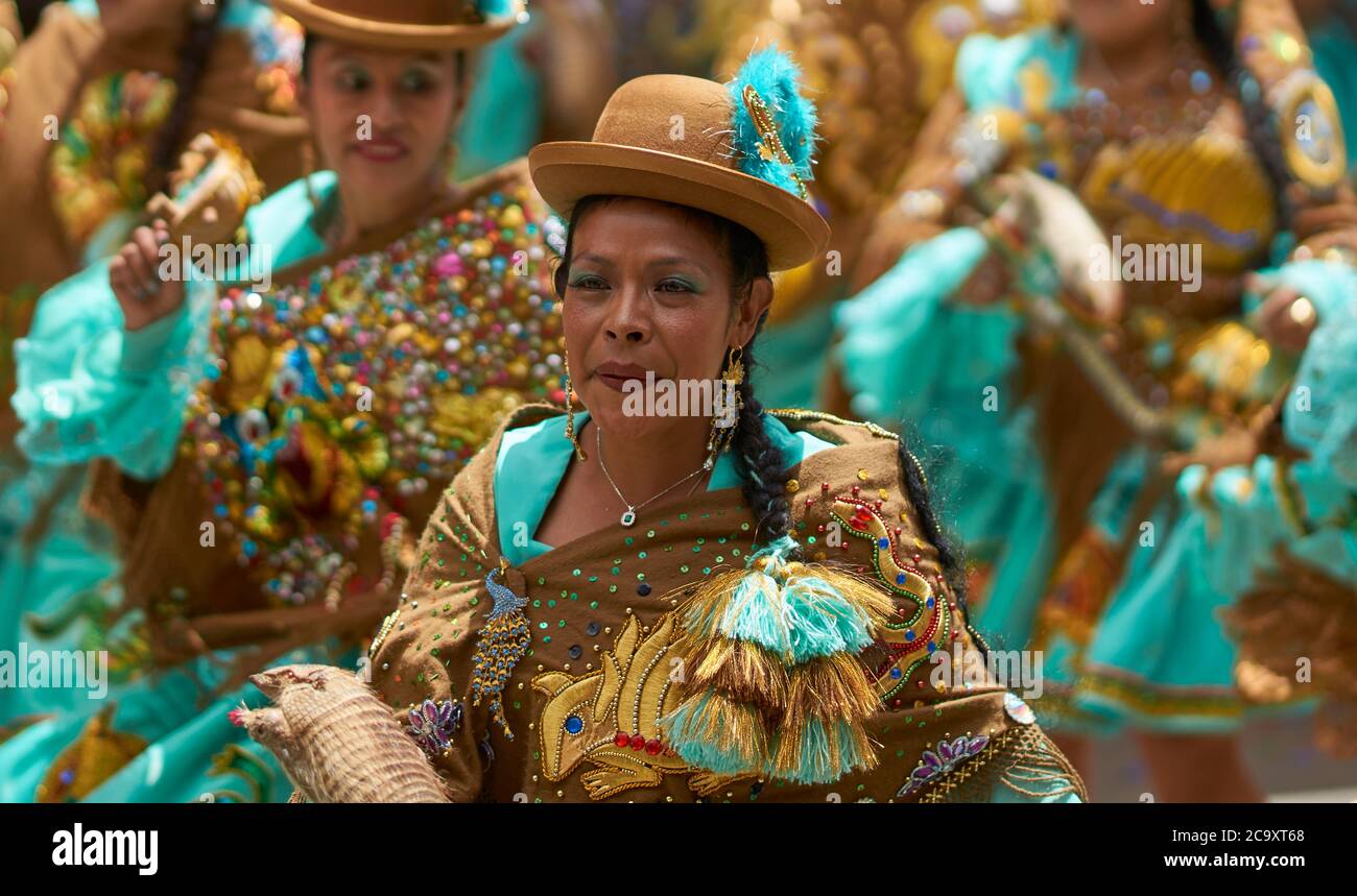 Morenada dancers in ornate costumes parade through the mining city of ...