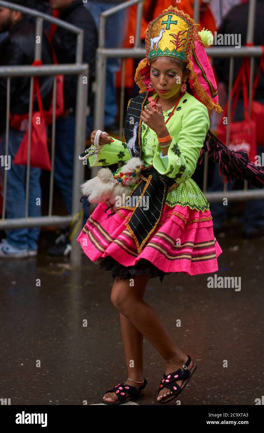 Llamerada dancers in ornate costumes performing as they parade through ...