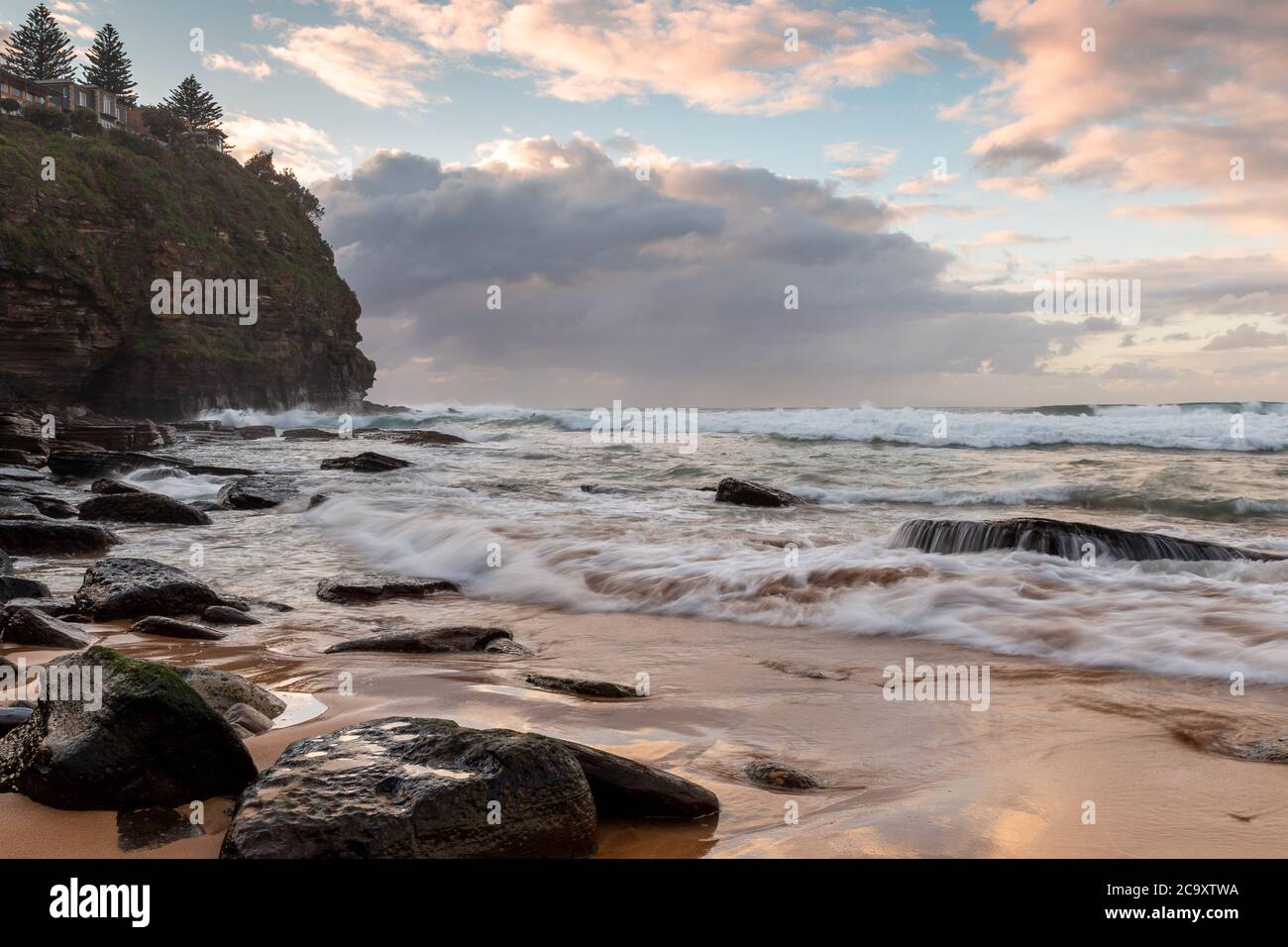 Bilgola beach during a golden sunrise Stock Photo - Alamy