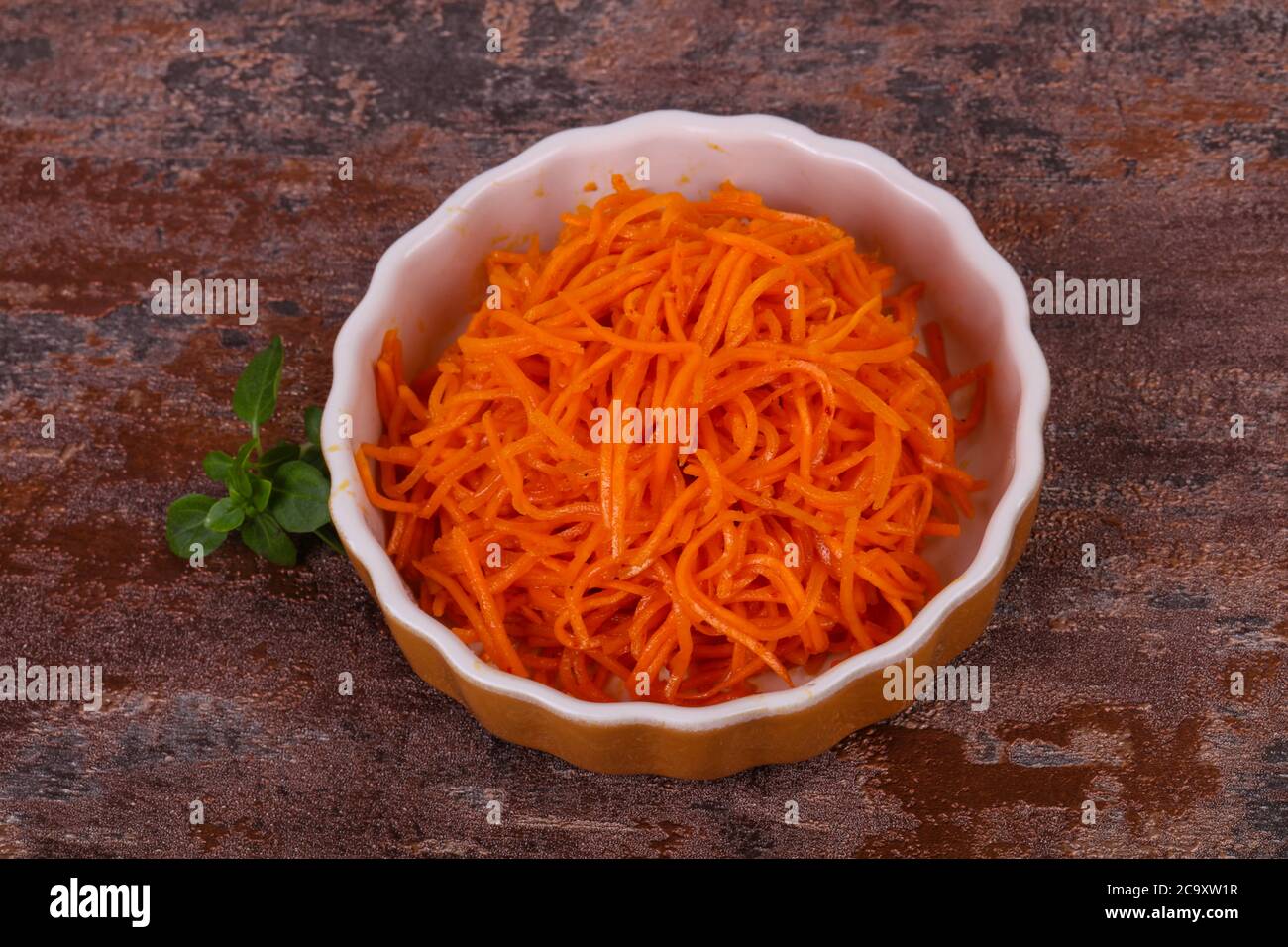 Korean cattot snack salad in the bowl served basil leaves Stock Photo ...