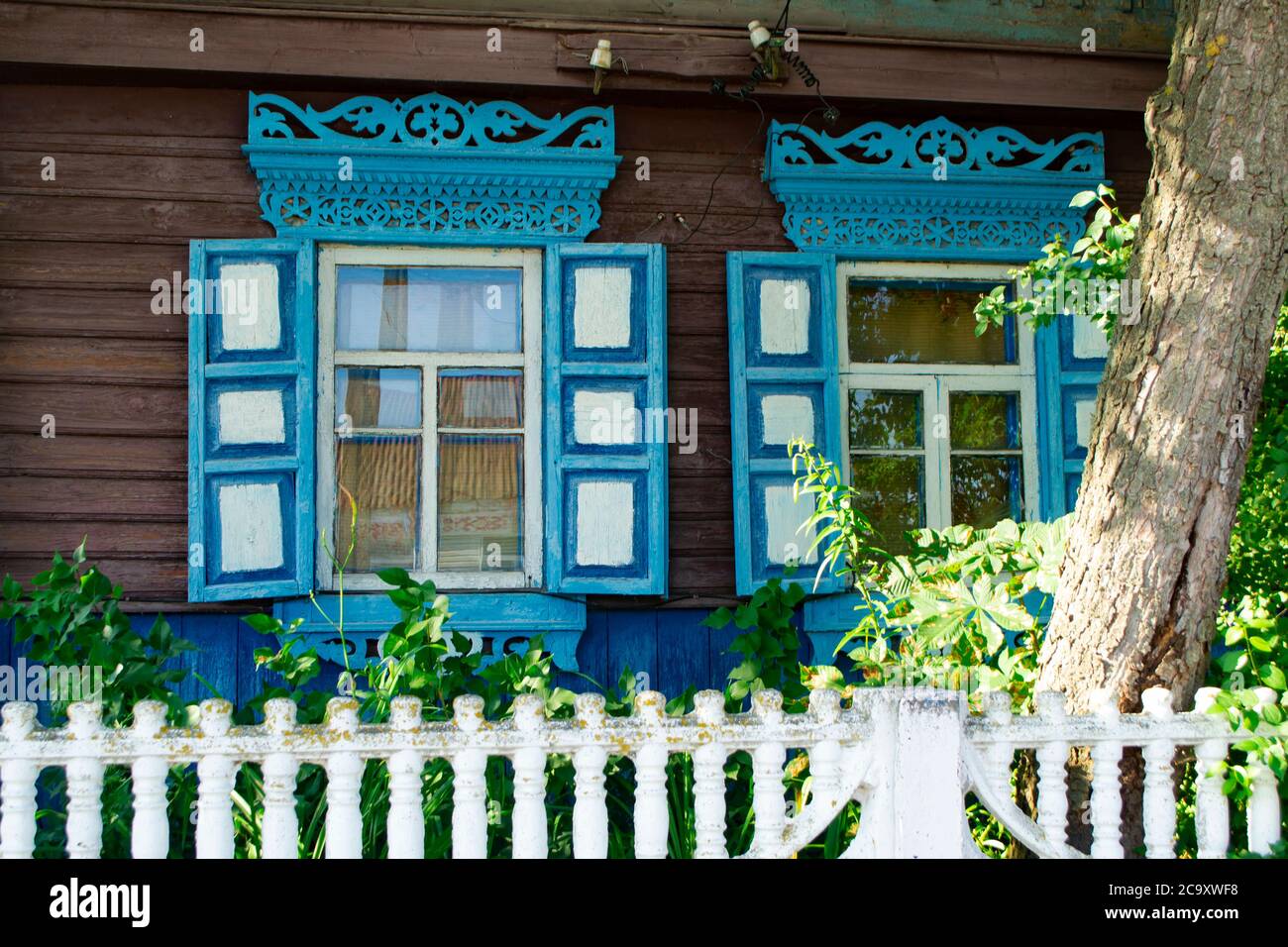 Blue figured wooden frame windows. Window frame of different shapes in ...