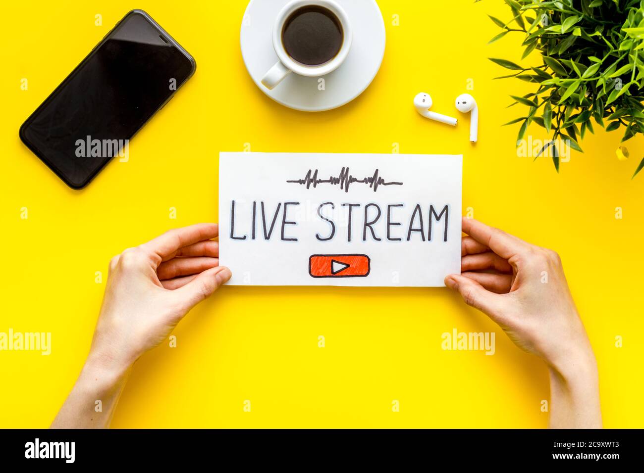Live streaming web network concept. Female hands holding paper tablet ...