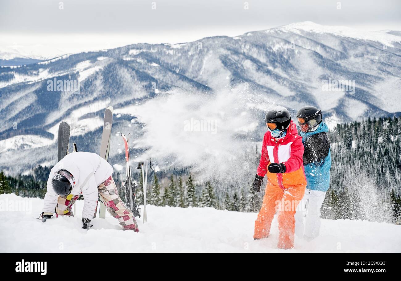 Group friends playing snowballs having hi-res stock photography and ...