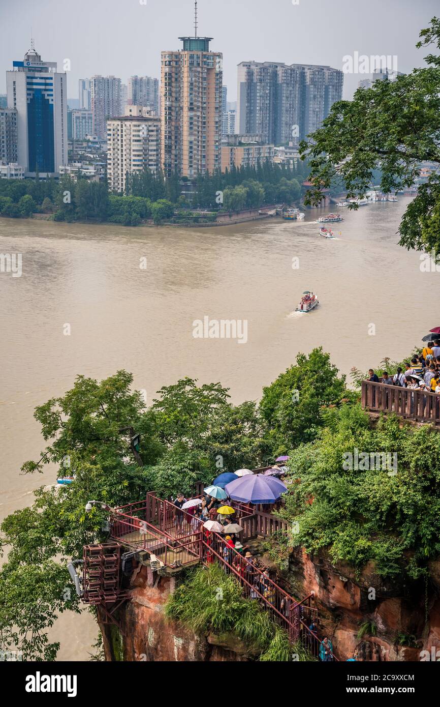 Leshan, China - July 2019 : Crowds walking down the plank walk around ...