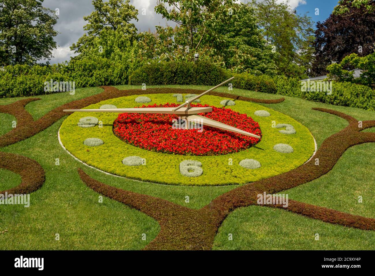 Vibrant floral clock display features colorful plants and intricate ...