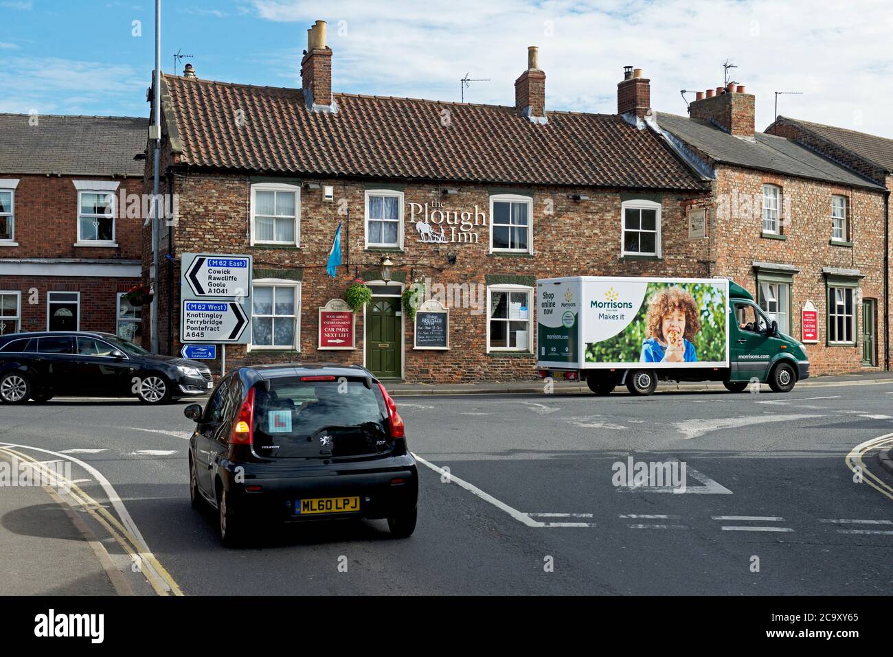 Traffic at mini roundabout in Snaith, East Yorkshire, England UK Stock ...