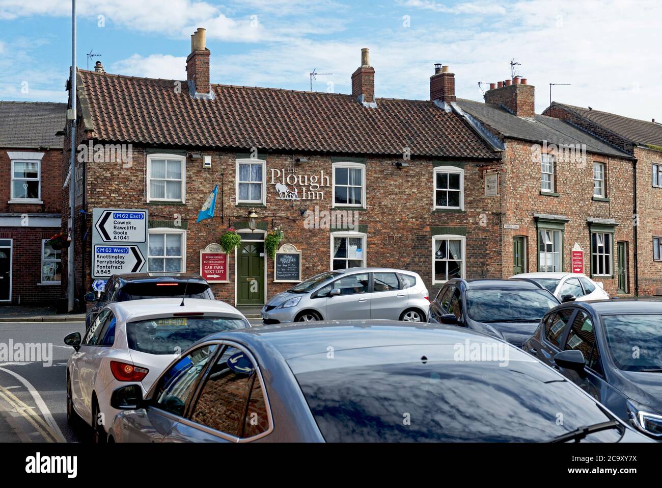 Traffic at mini roundabout in Snaith, East Yorkshire, England UK Stock ...