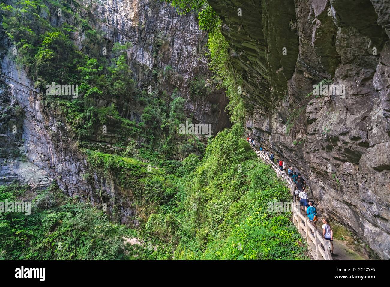 Wulong, China - August 2019 : Tourists walking in line on a narrow ...