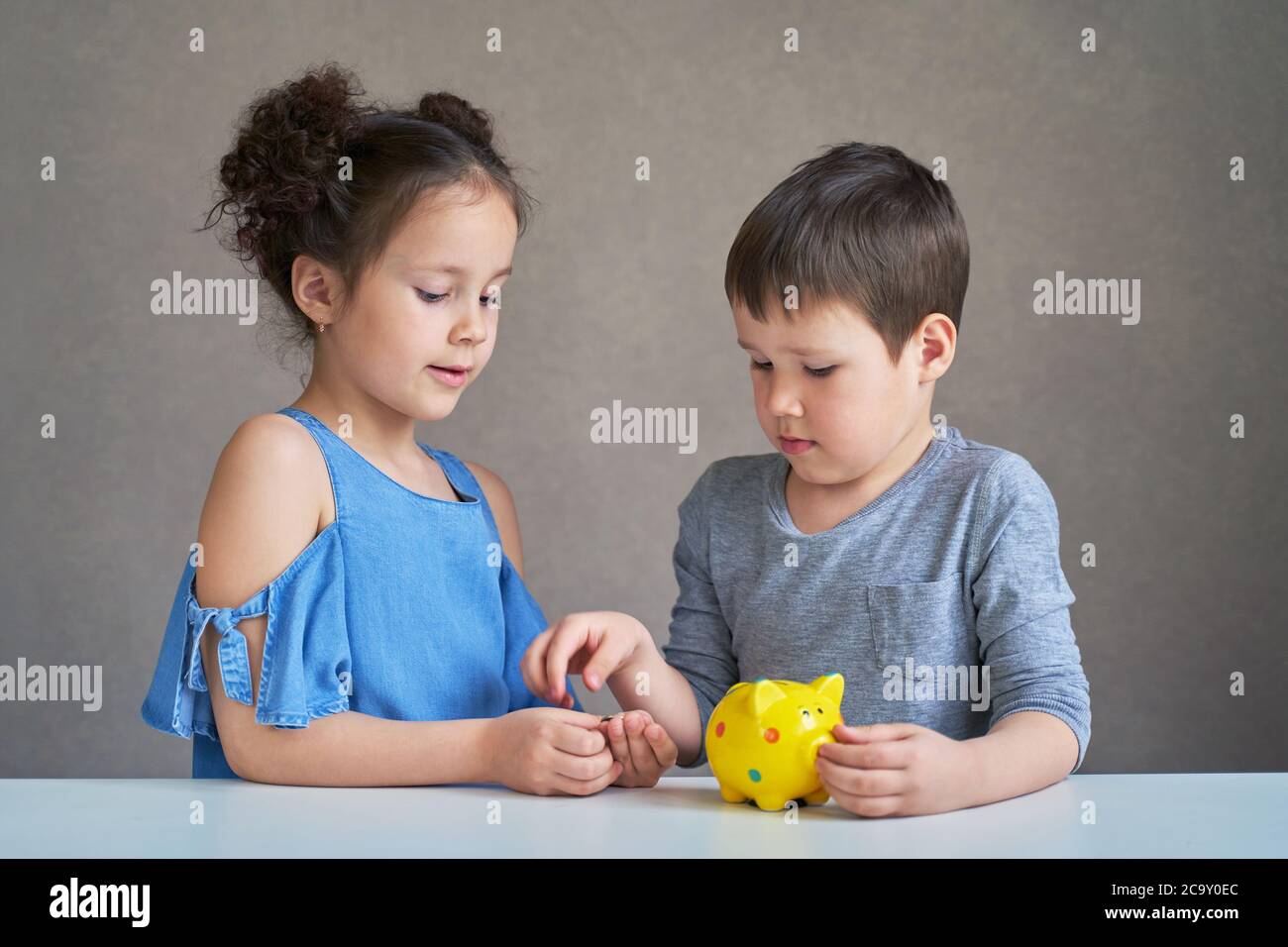 Children holding money hi-res stock photography and images - Alamy