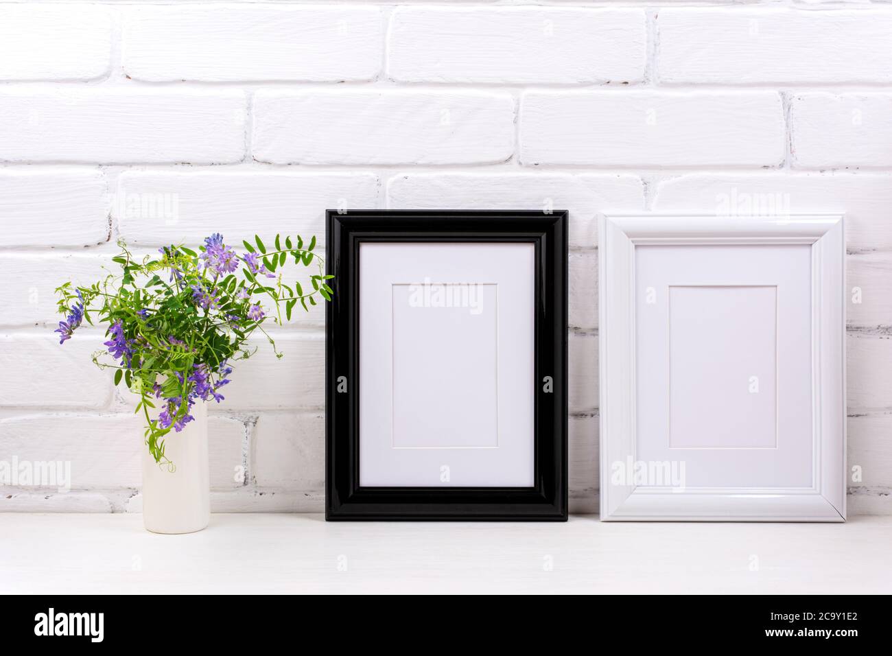 Two black white frames with mat mockup with purple bird vetch in the ...