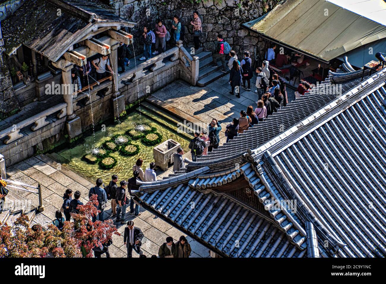 Pilgrims and tourists drinking from the Otowa-no-Taki waterfall holy ...