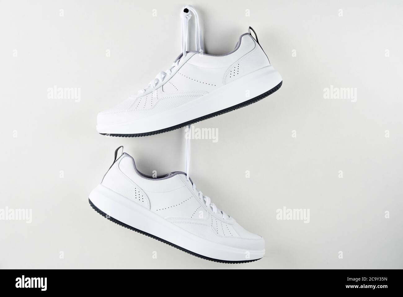 Running shoes hanging up hi-res stock photography and images - Alamy