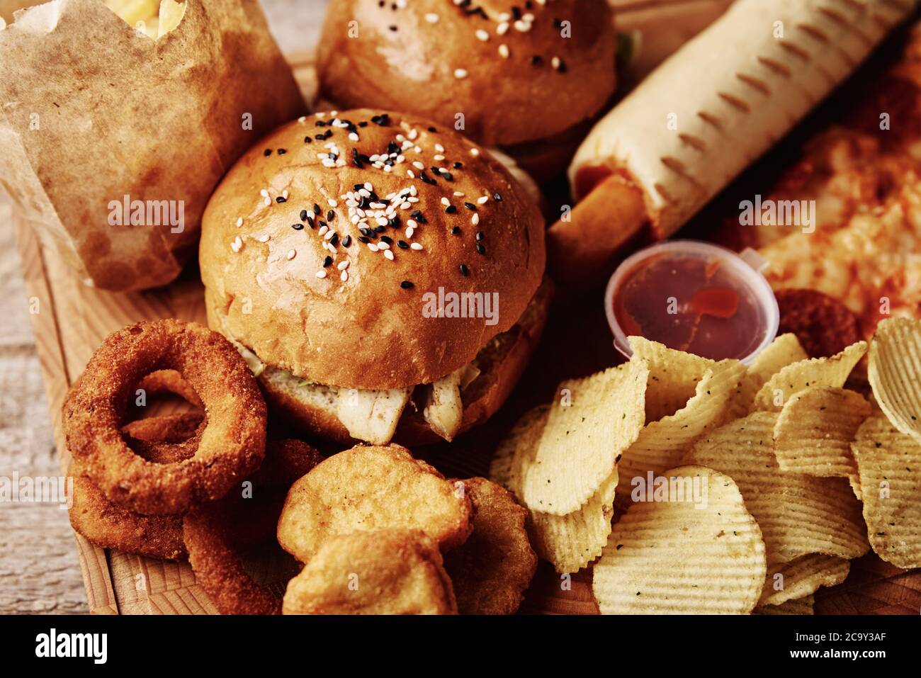 Unhealthy and junk food. Different types of fastfood and snacks on the ...