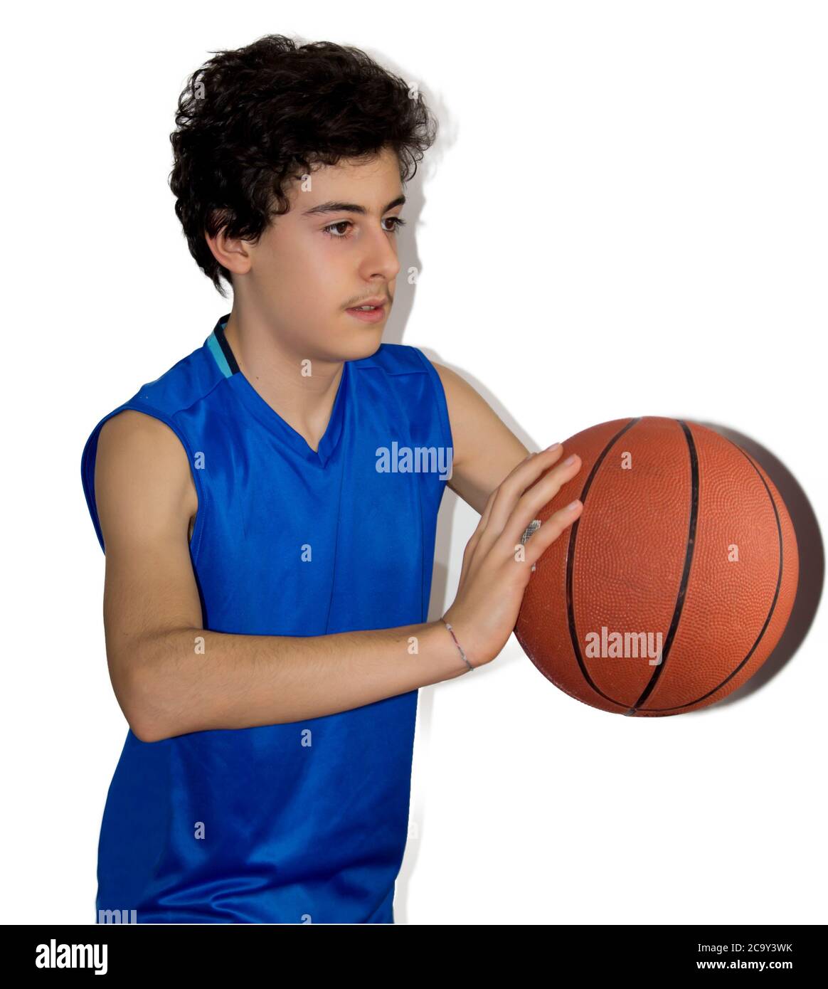 Young boy playing basketball with isolated background Stock Photo - Alamy