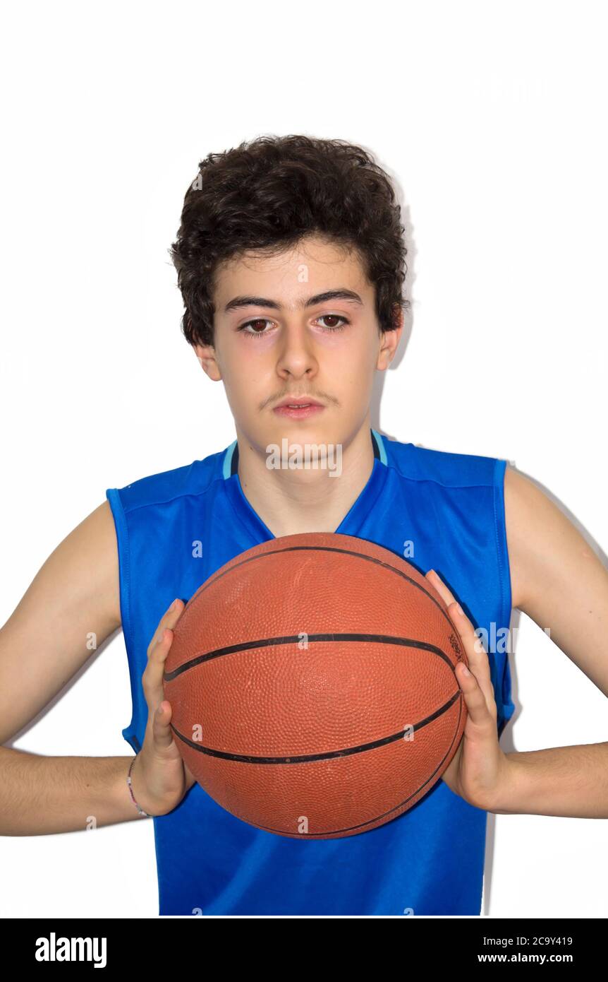 Young boy playing basketball with isolated background Stock Photo - Alamy