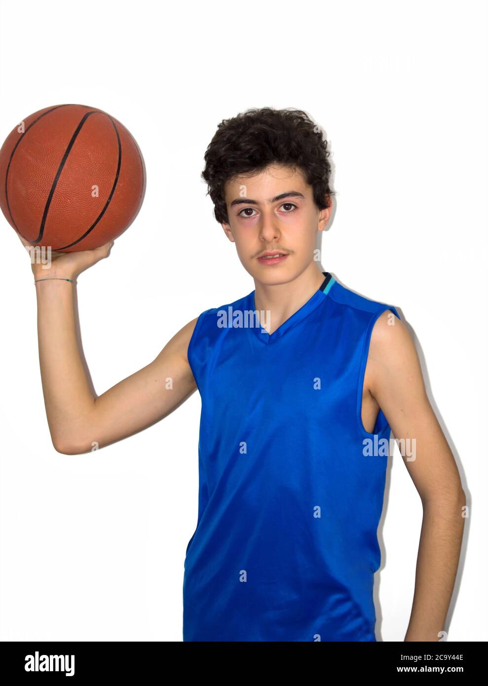 Young boy playing basketball with isolated background Stock Photo - Alamy