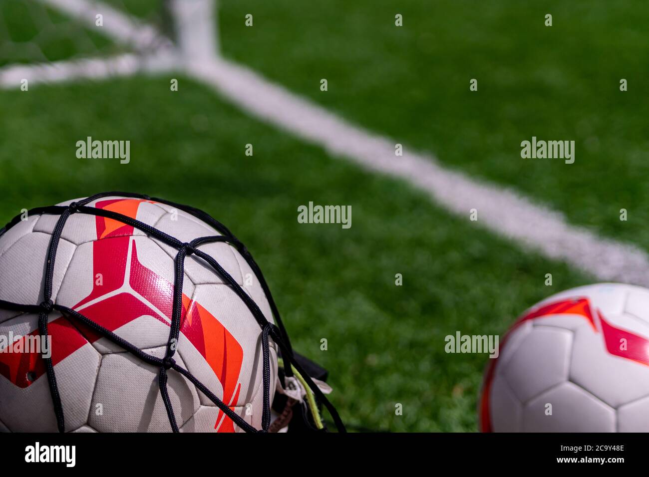 Football balls on a pich. Soccer background with copy space Stock Photo ...