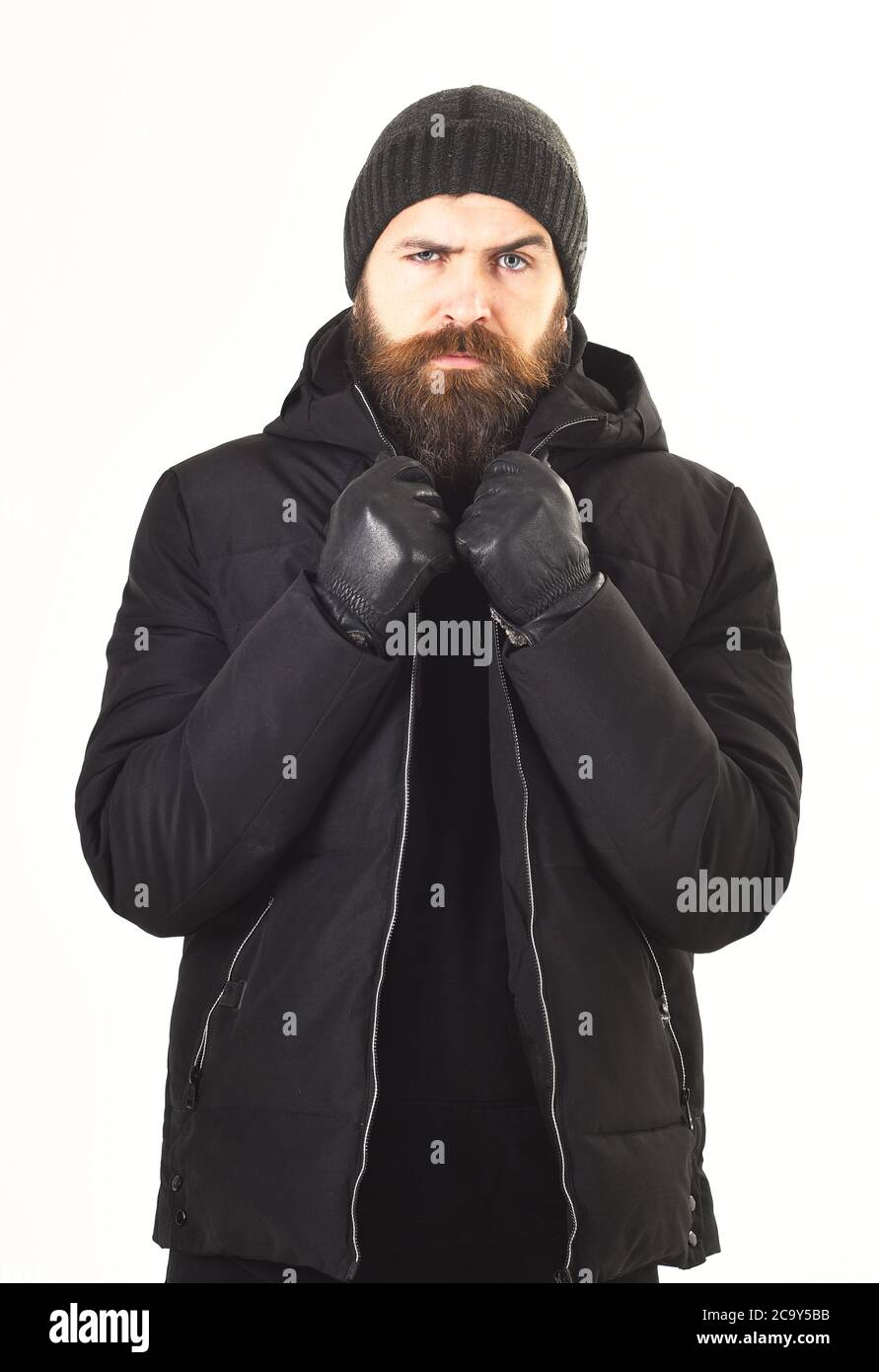 Guy with beard warming up. Man with stylish appearance wears warm ...