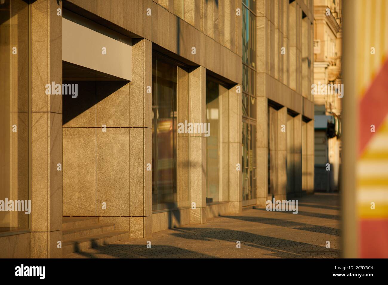 empty city street at the sunset. office building Stock Photo - Alamy