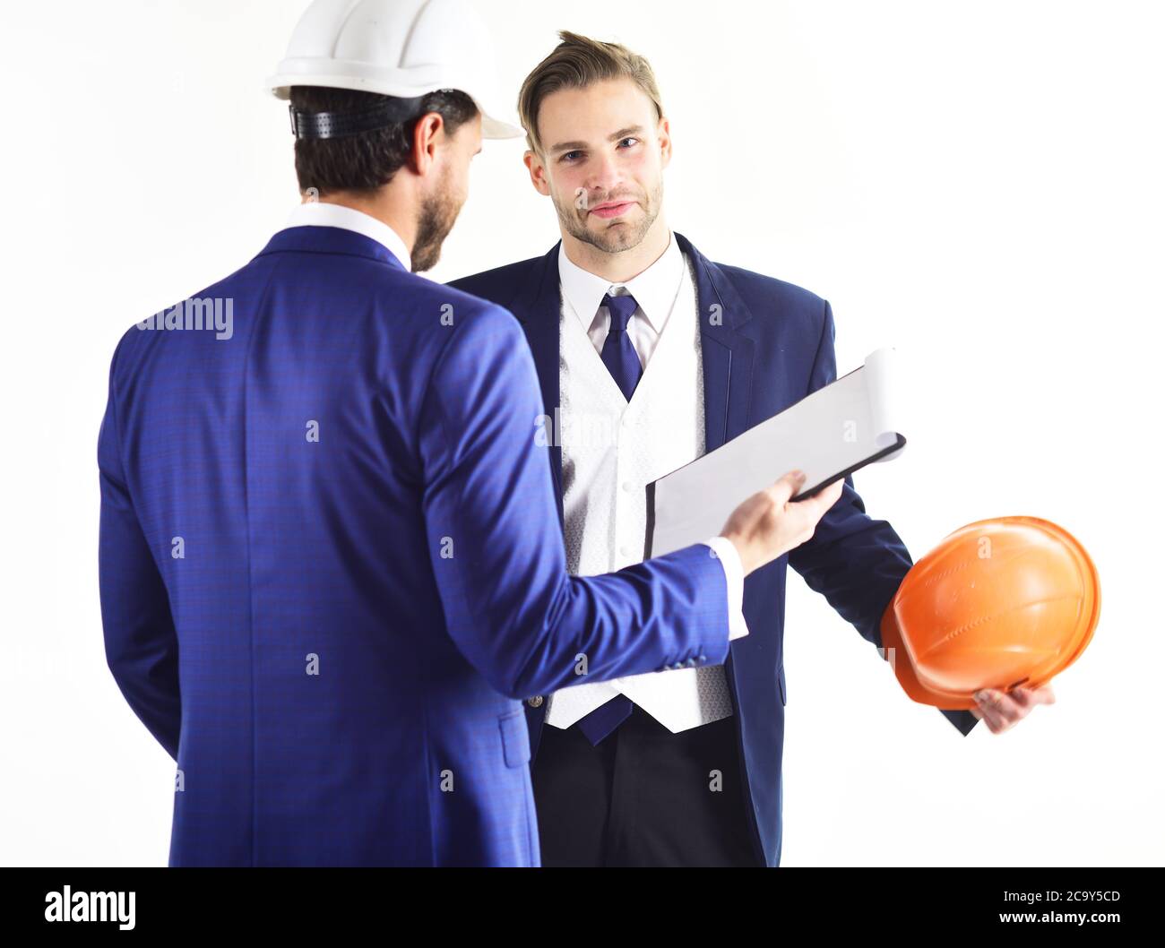 Employee with working helmet at business meeting. Engineering ...