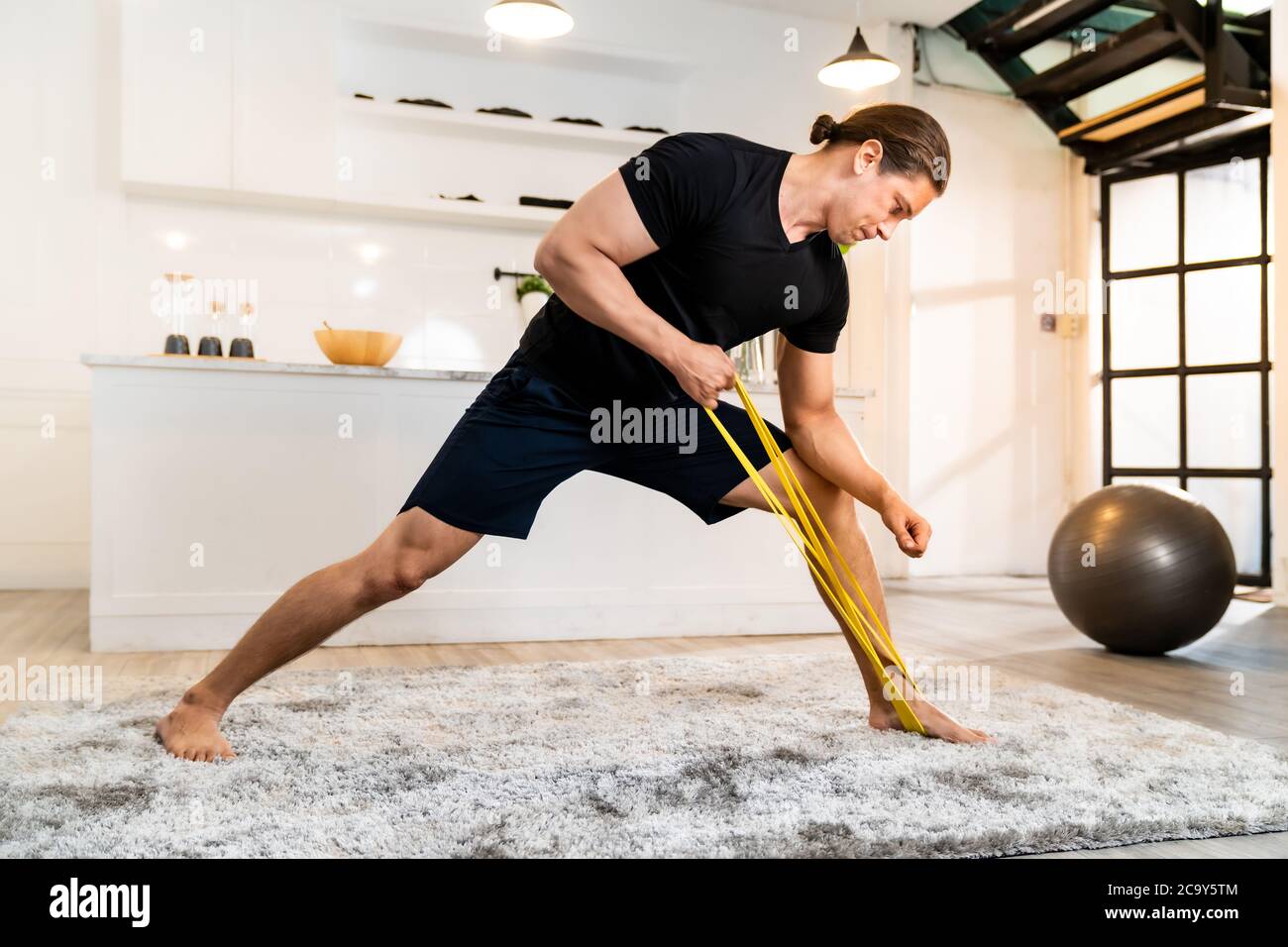 White caucasian fit sporty muscular man doing exercise with stretching ...