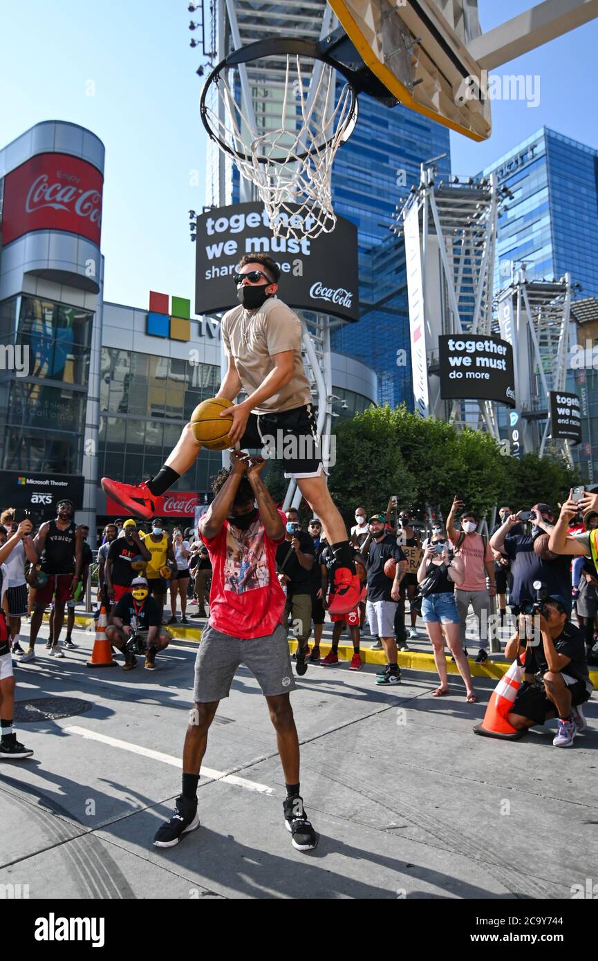 Los Angeles, United States. 02nd Aug, 2020. A man dunks the a ball at ...
