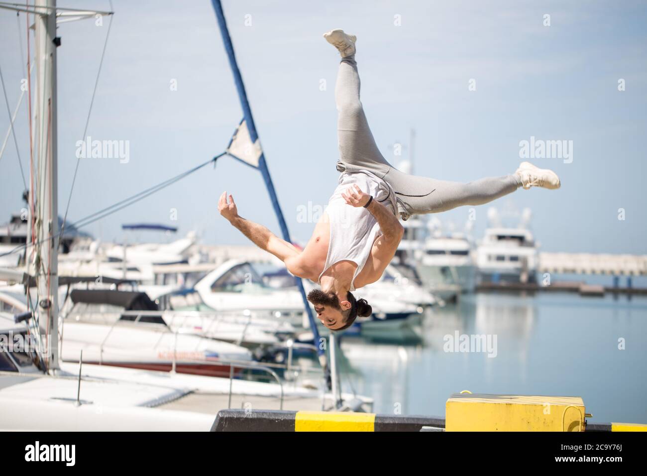 Muscular caucasian athlete increasing power with plyometric workout ...