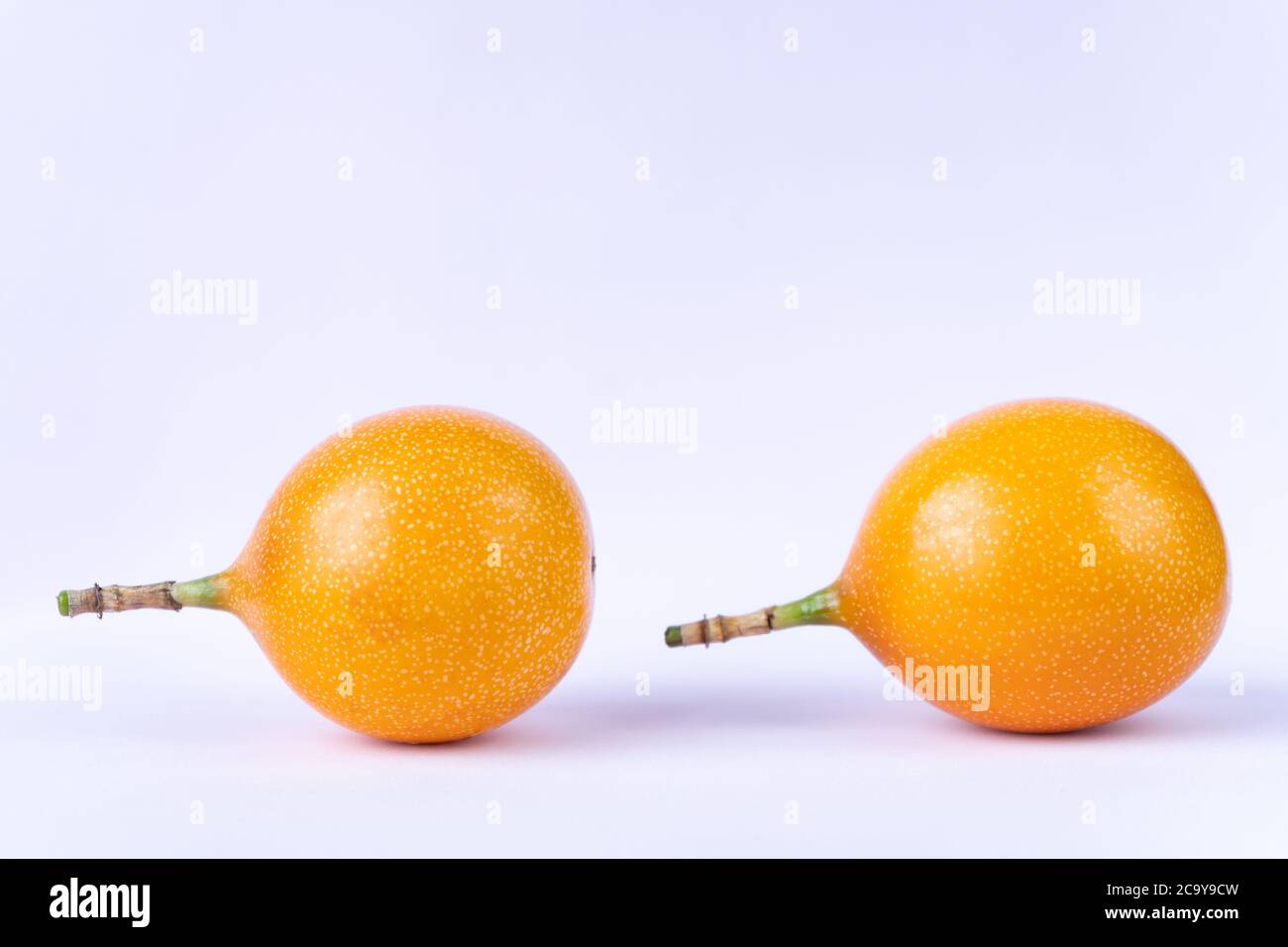 Image of ripe fresh granadilla on white background Stock Photo - Alamy