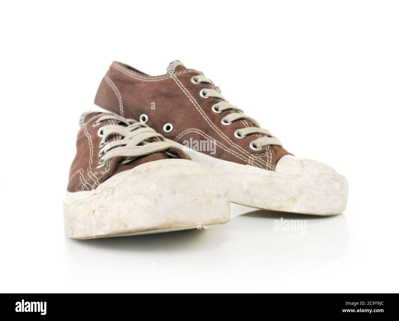 Used sneakers isolated on white Stock Photo - Alamy