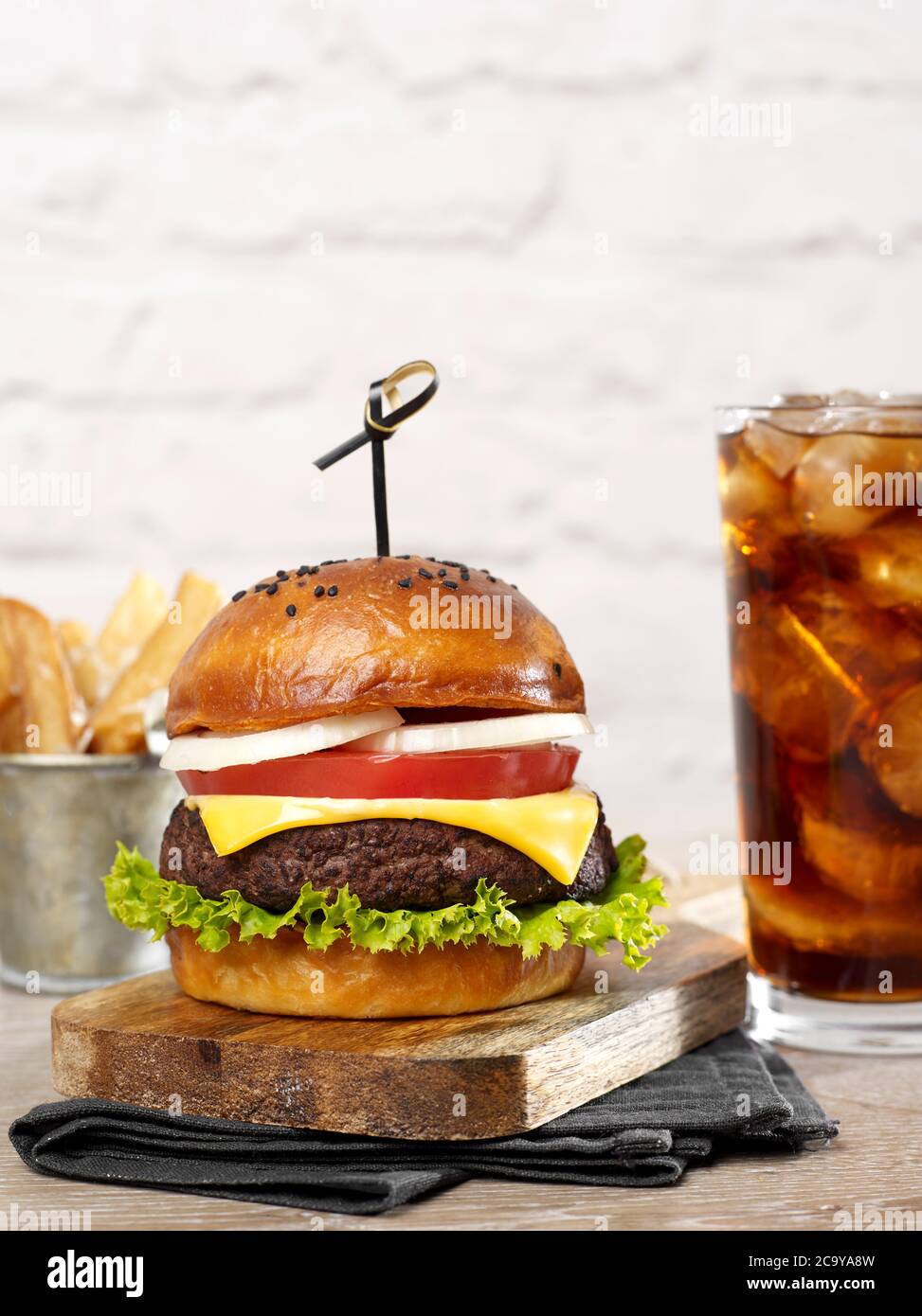 Cheeseburger with fries and drink Stock Photo - Alamy