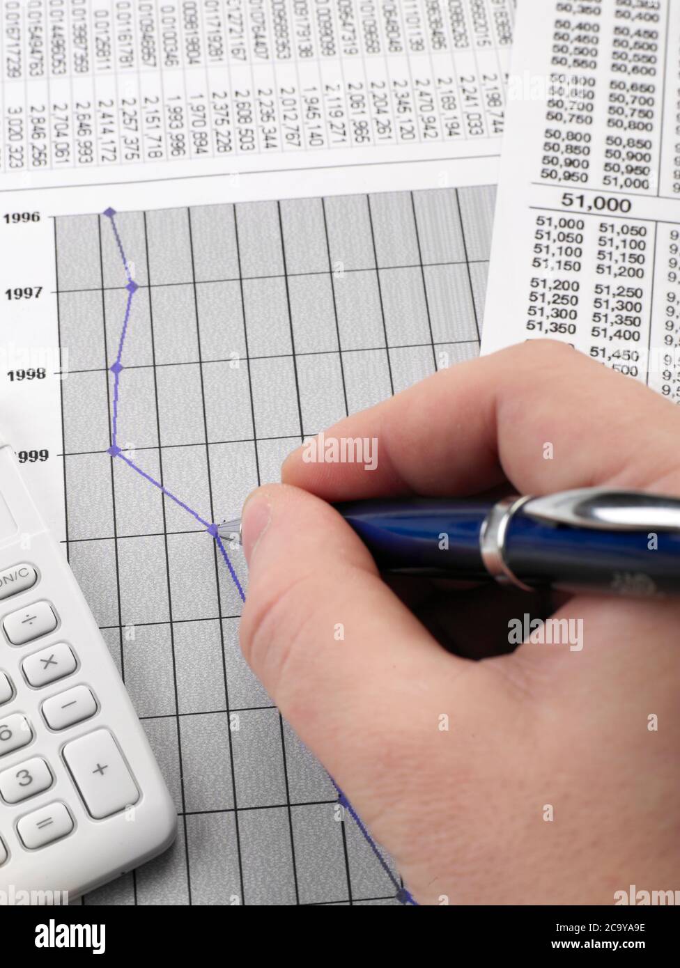 Completing financial papers Stock Photo - Alamy