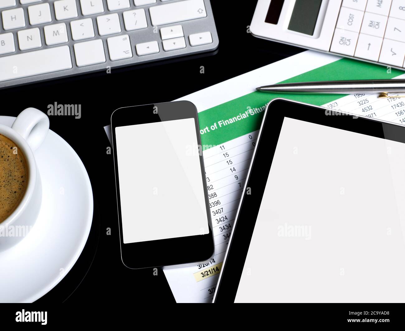 Digital tablet and mobile phone on desk Stock Photo - Alamy